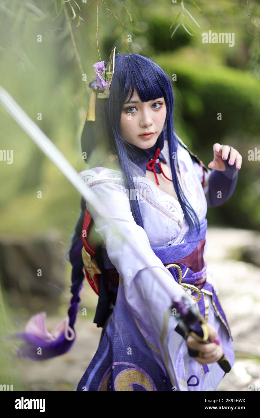 Portrait of a beautiful young woman game cosplay with samurai dress ...
