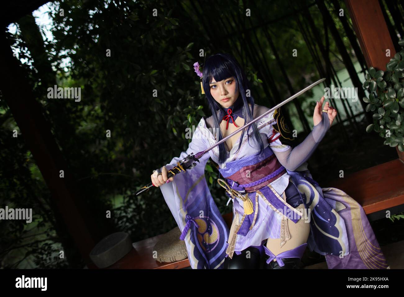 Portrait of a beautiful young woman game cosplay with samurai dress ...
