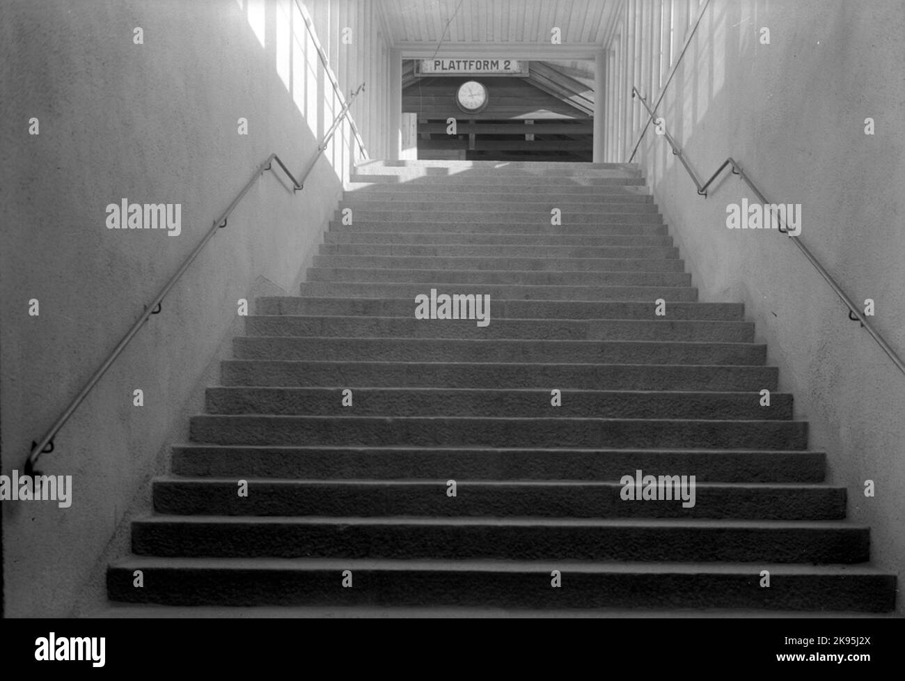 Passenger tunnel, staircase up to platform Stock Photo - Alamy