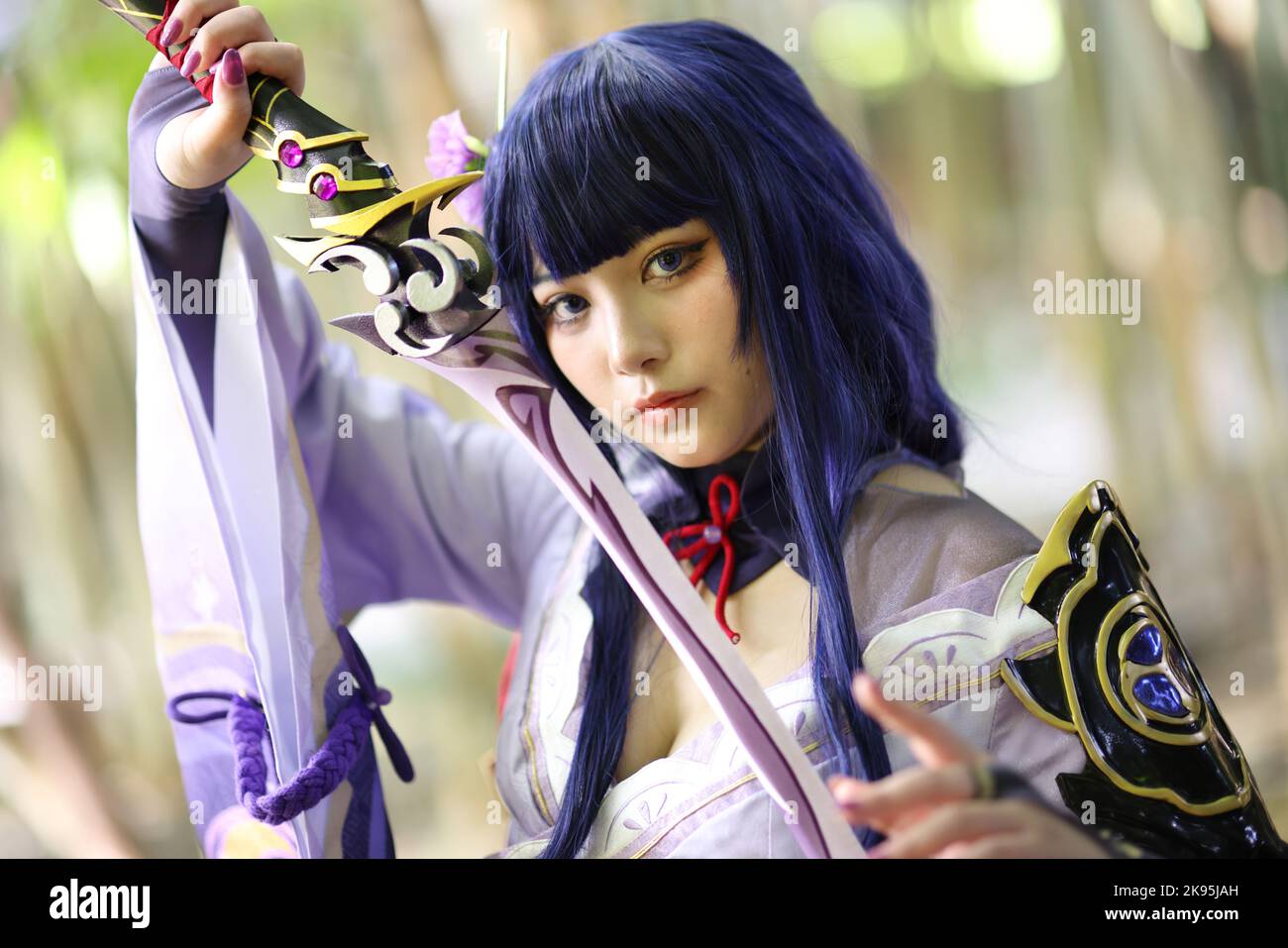 Portrait of a beautiful young woman game cosplay with samurai dress ...