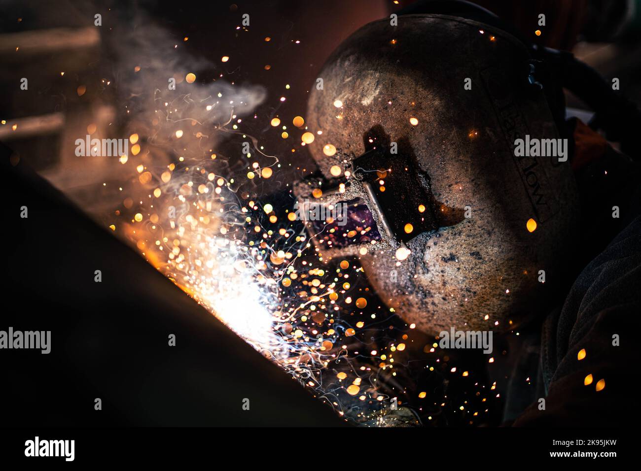 The welder is assembling the workpiece, close-up Stock Photo - Alamy