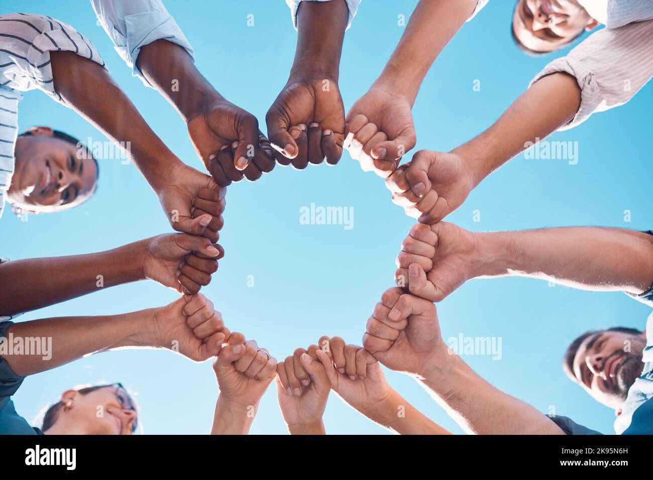 Fist bump, teamwork and business people in a team building meeting for collaboration, motivation ...