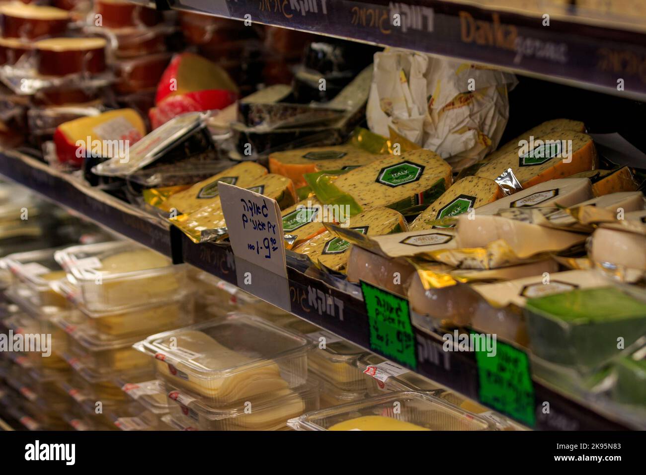 A closeup shot of various Cheese types with prices in the Carmel Market ...