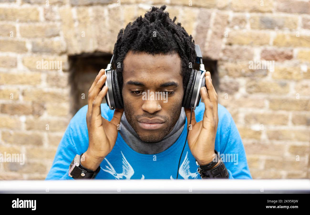 The Media Agency: Checking Levels. An audio engineer working at his ...