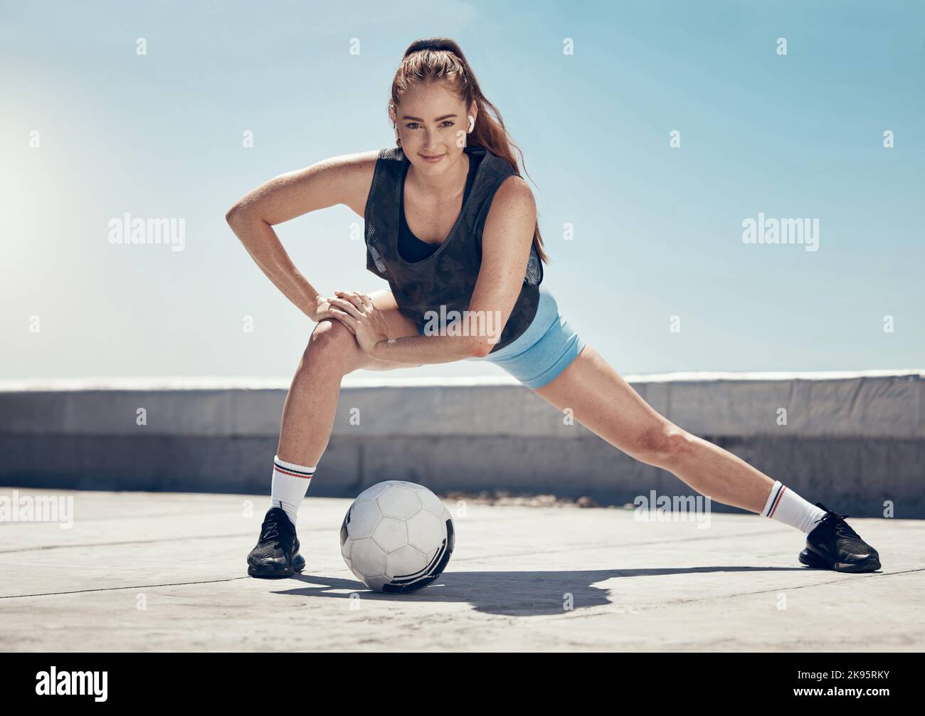 Woman, soccer and fitness stretching workout in city for football ...