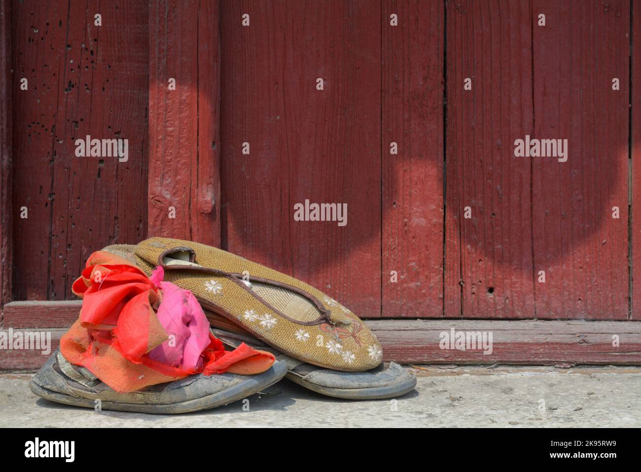 Old shoes drying outside of a house in a small Chinese village Stock ...
