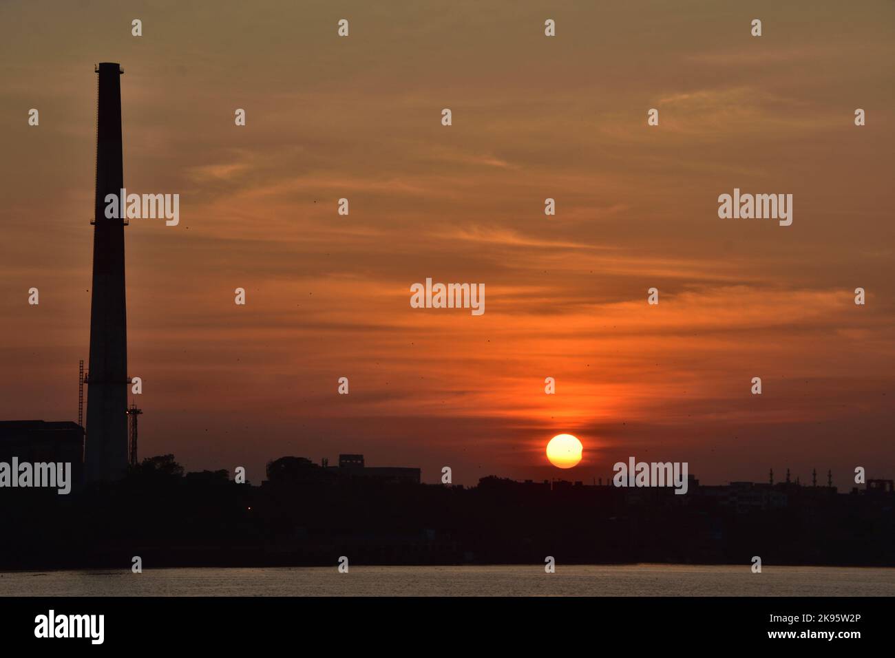 Oct 25, 2022, Kolkata, India: People look partial solar eclipse during ...