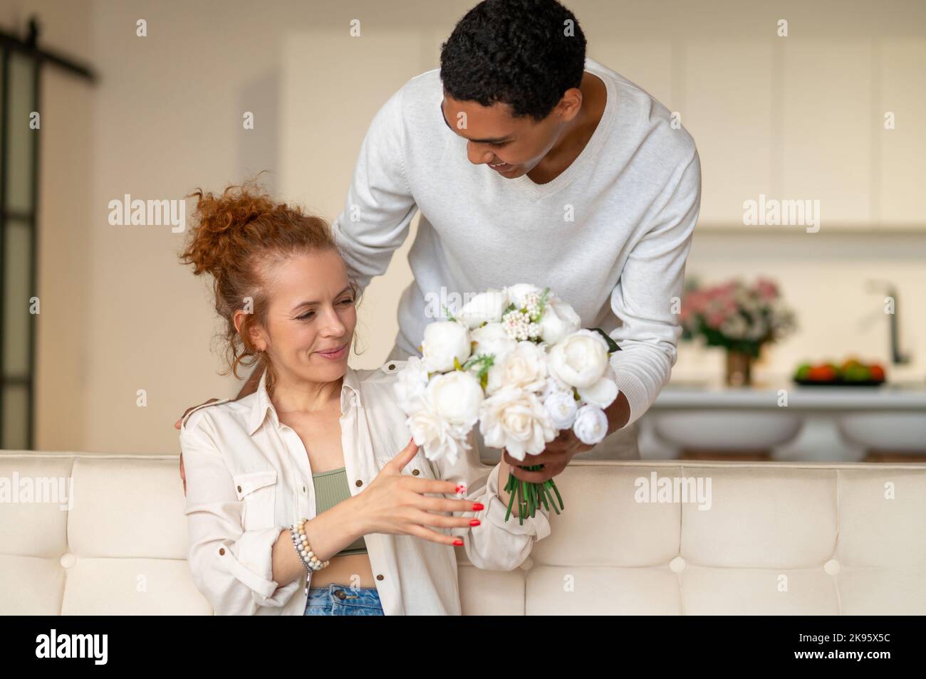 African american man giving flowers hi-res stock photography and images ...