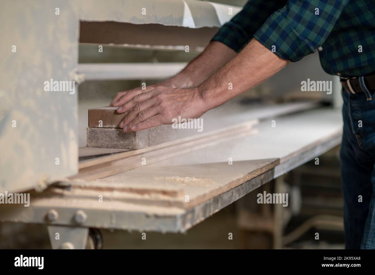 Craft person working with wood in a workshop Stock Photo - Alamy