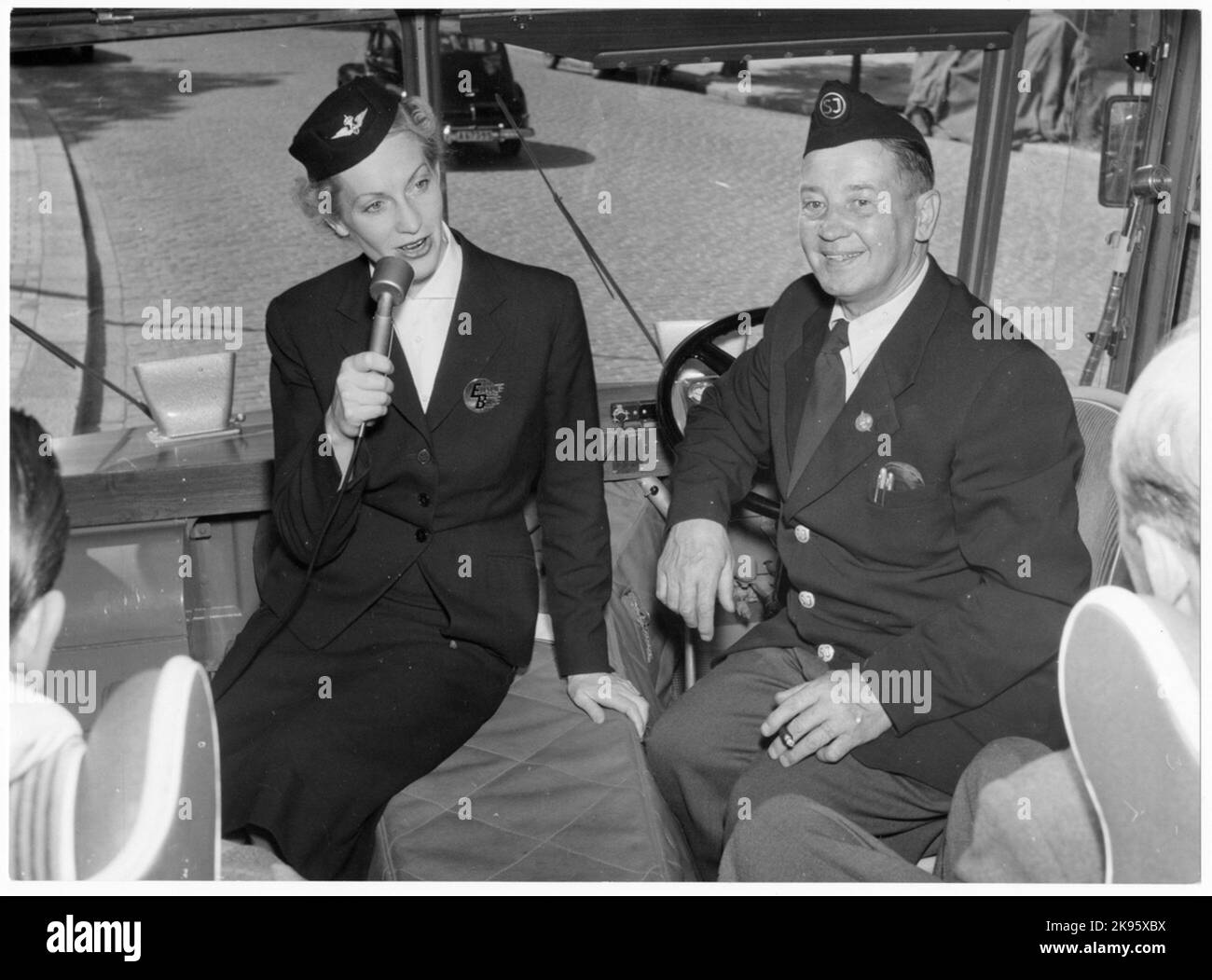 Bus hostess and driver in a tourist bus. State Railways, SJ Bus 2286 ...