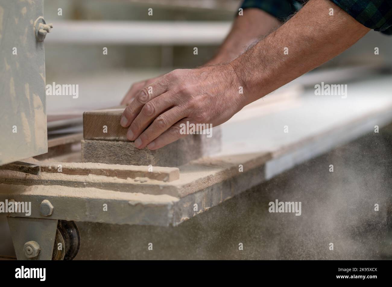 Craft person working with wood in a workshop Stock Photo - Alamy