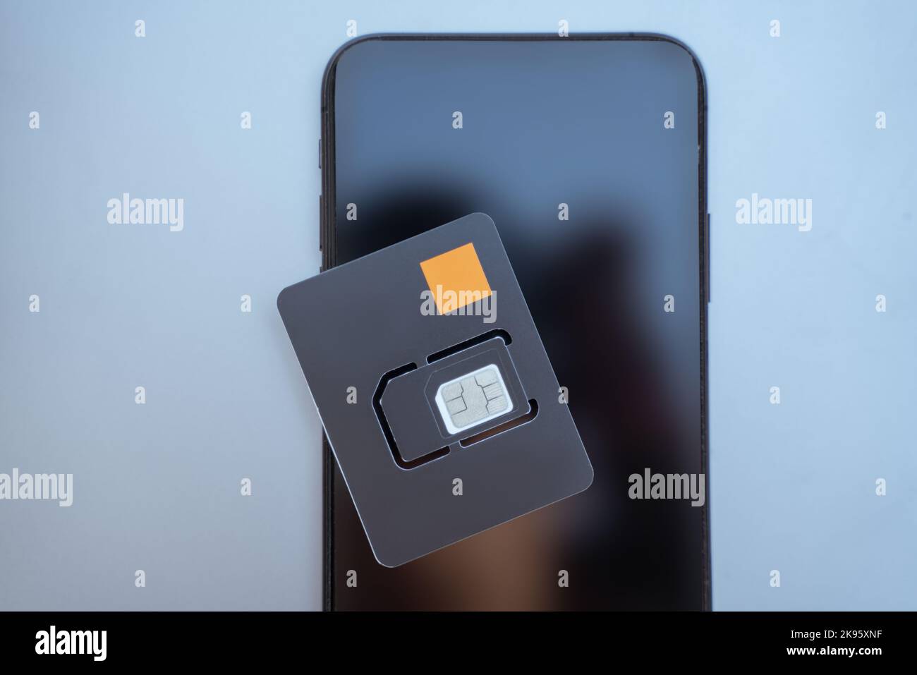 Close up picture of a smartphone with a sim card Stock Photo - Alamy