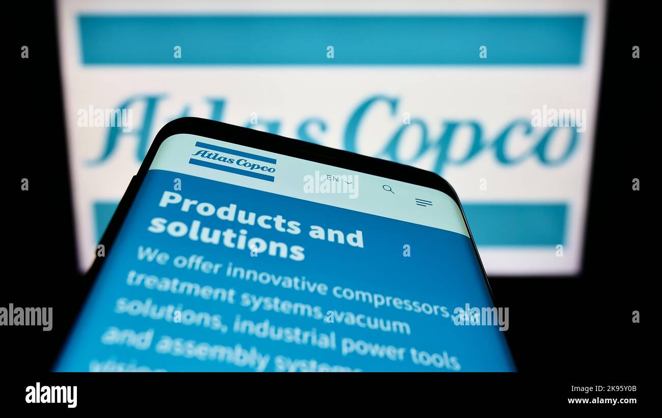Mobile phone with webpage of Swedish industrial company Atlas Copco AB ...