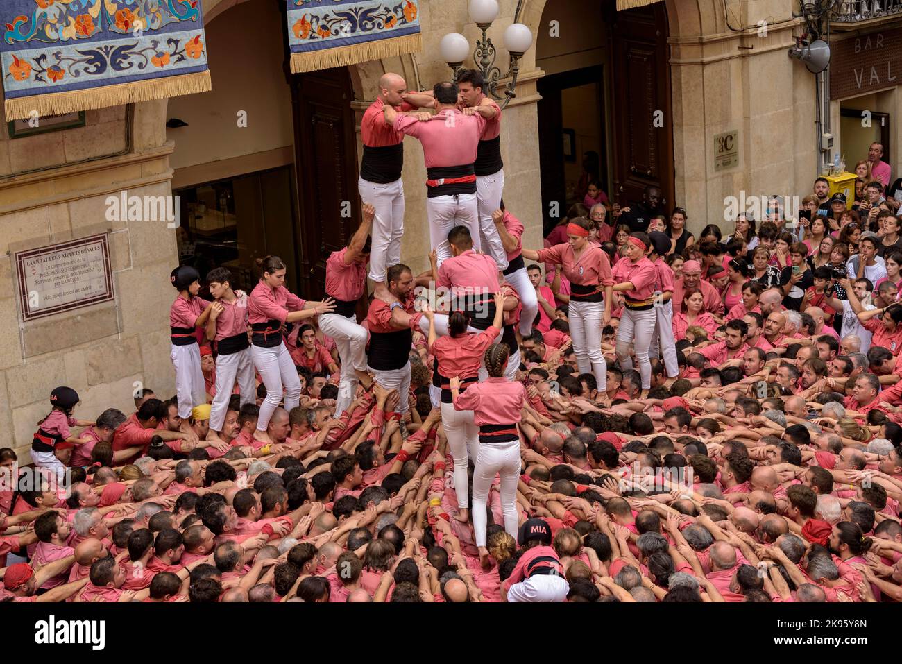 Raising a Castell (human tower) "3 of 9" of the Colla Vella dels ...