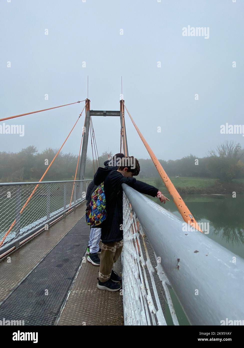 Family of three adventure in a cold winter looking nature view from a ...