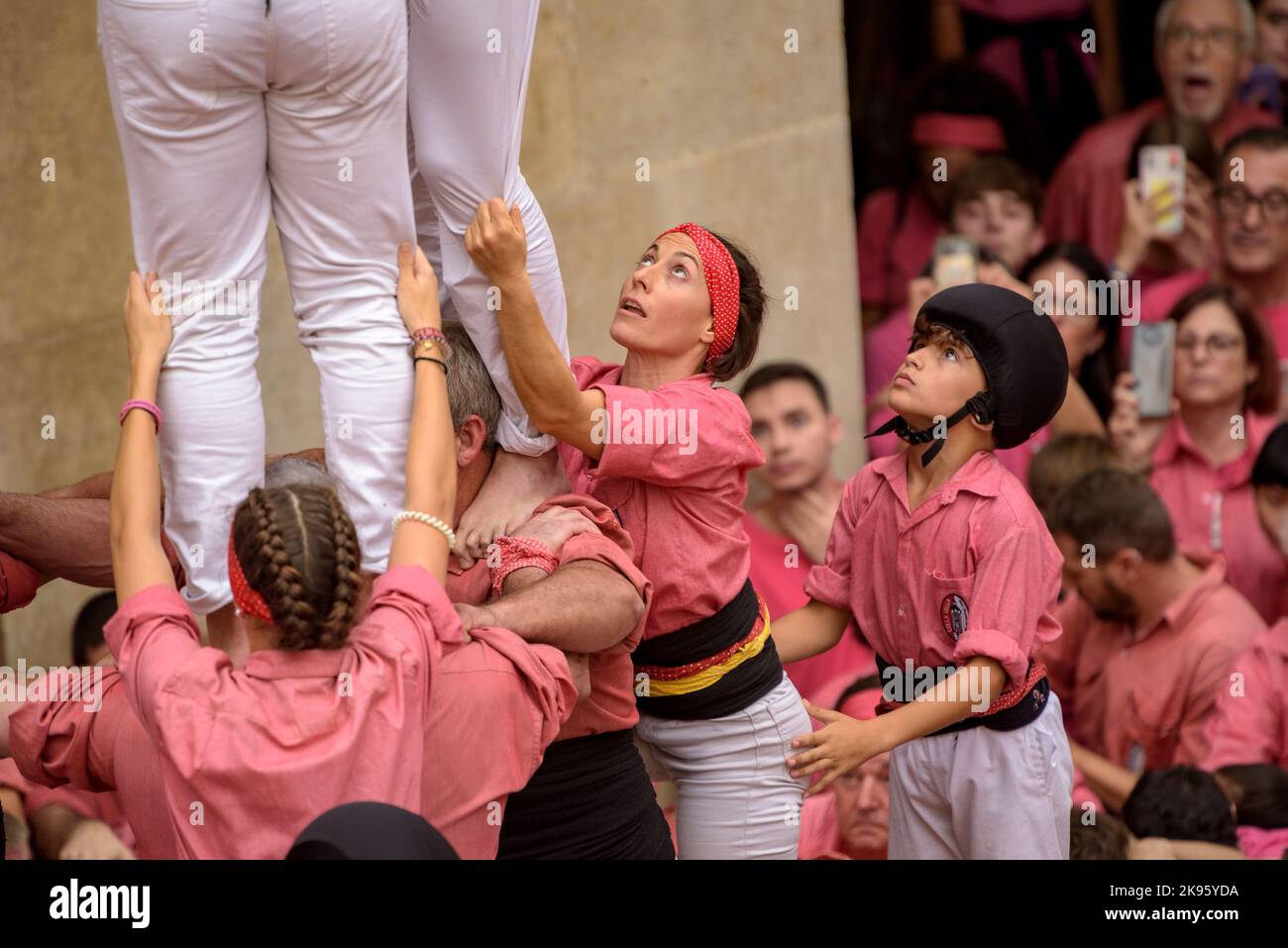 Raising a Castell (human tower) "3 of 9" of the Colla Vella dels ...