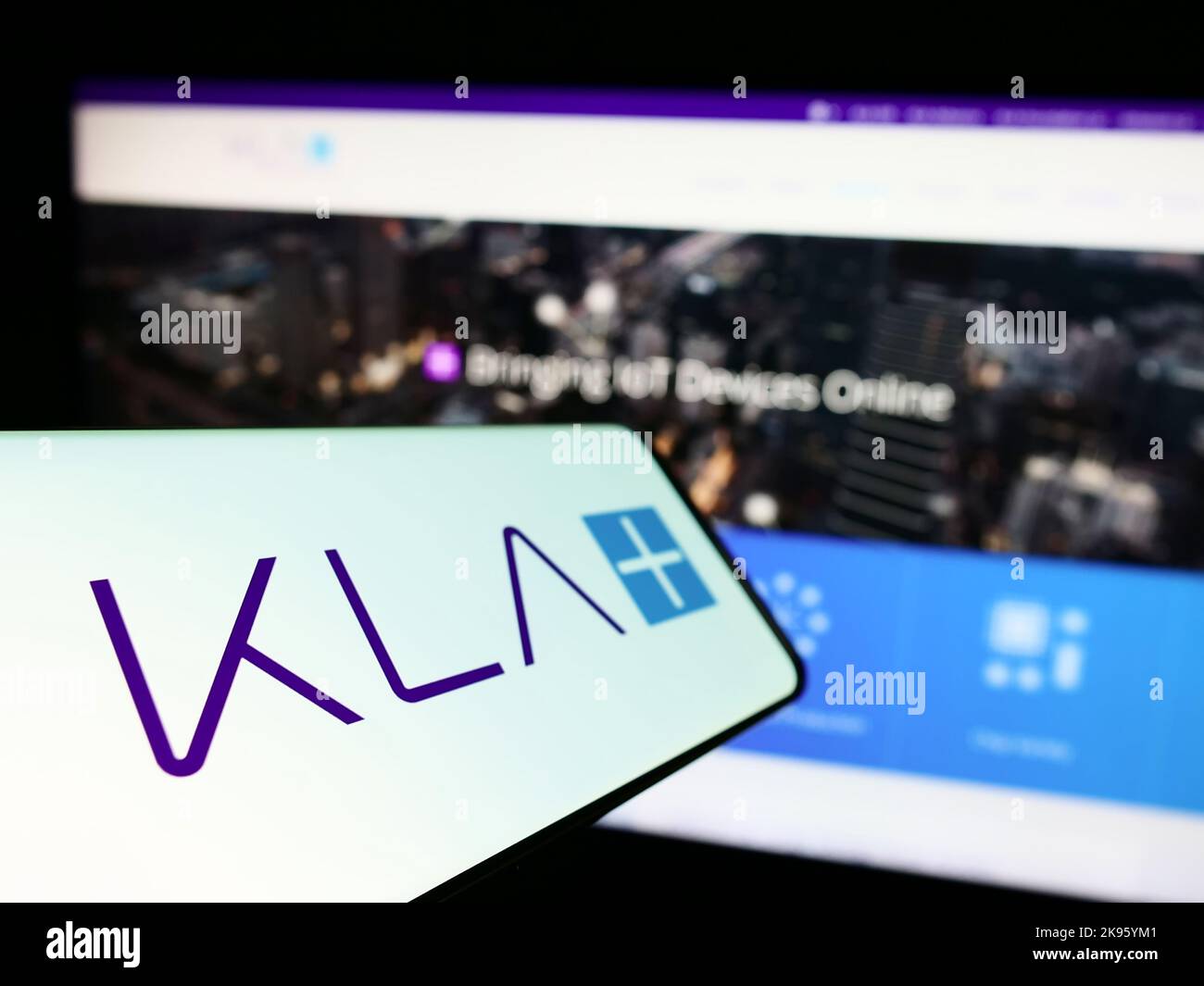 Cellphone with logo of American semiconductor company KLA Corporation ...