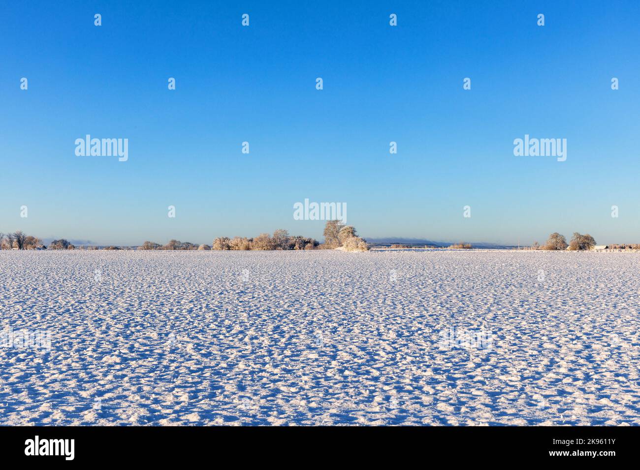 Plain landscape view with snow on a sunny winter day Stock Photo - Alamy