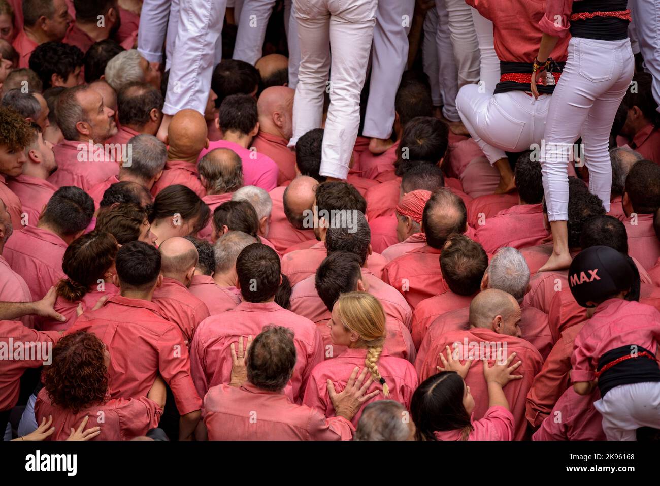Raising a Castell (human tower) "3 of 9" of the Colla Vella dels ...