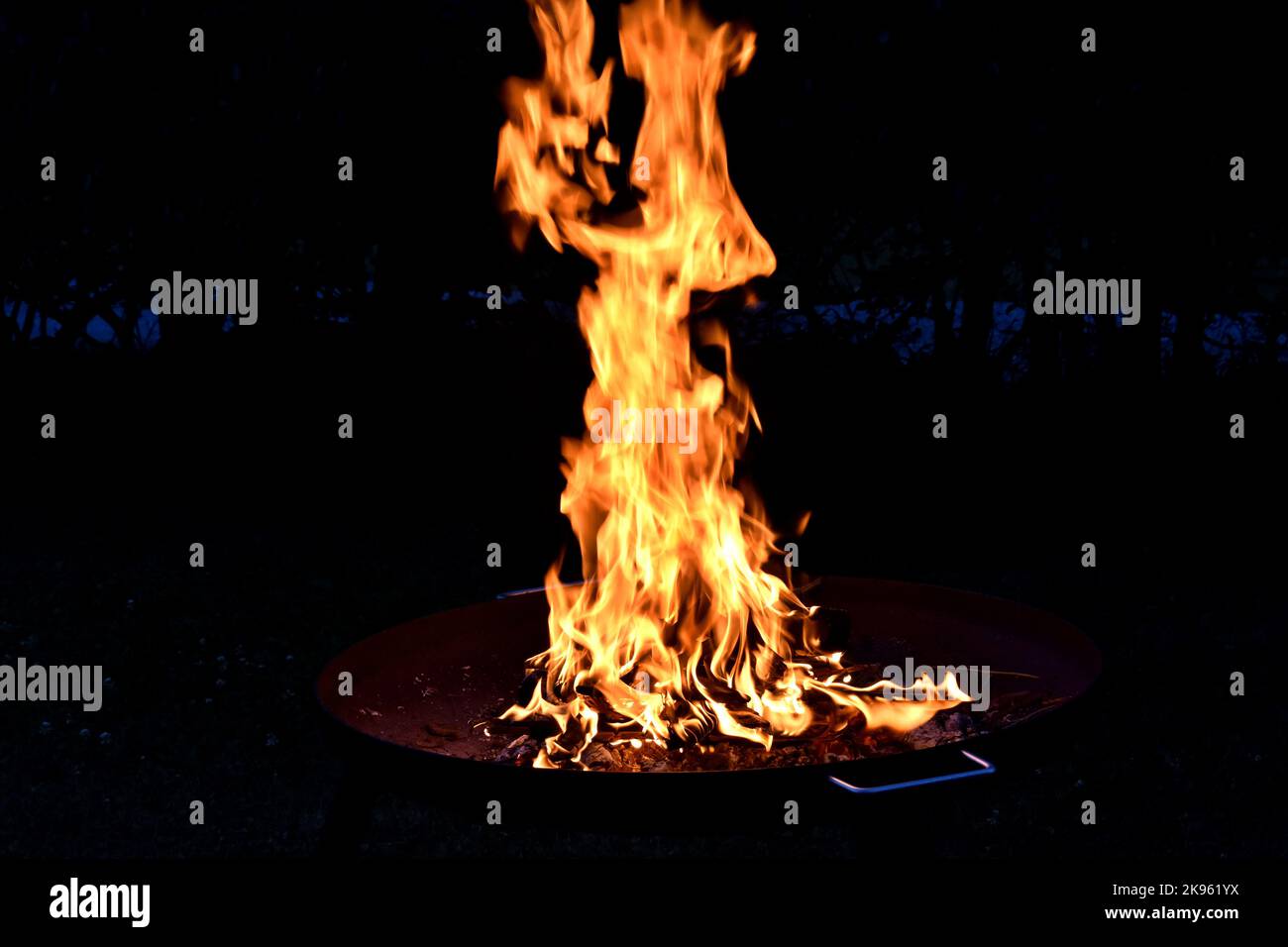 A glowing fire on disc grill Stock Photo - Alamy