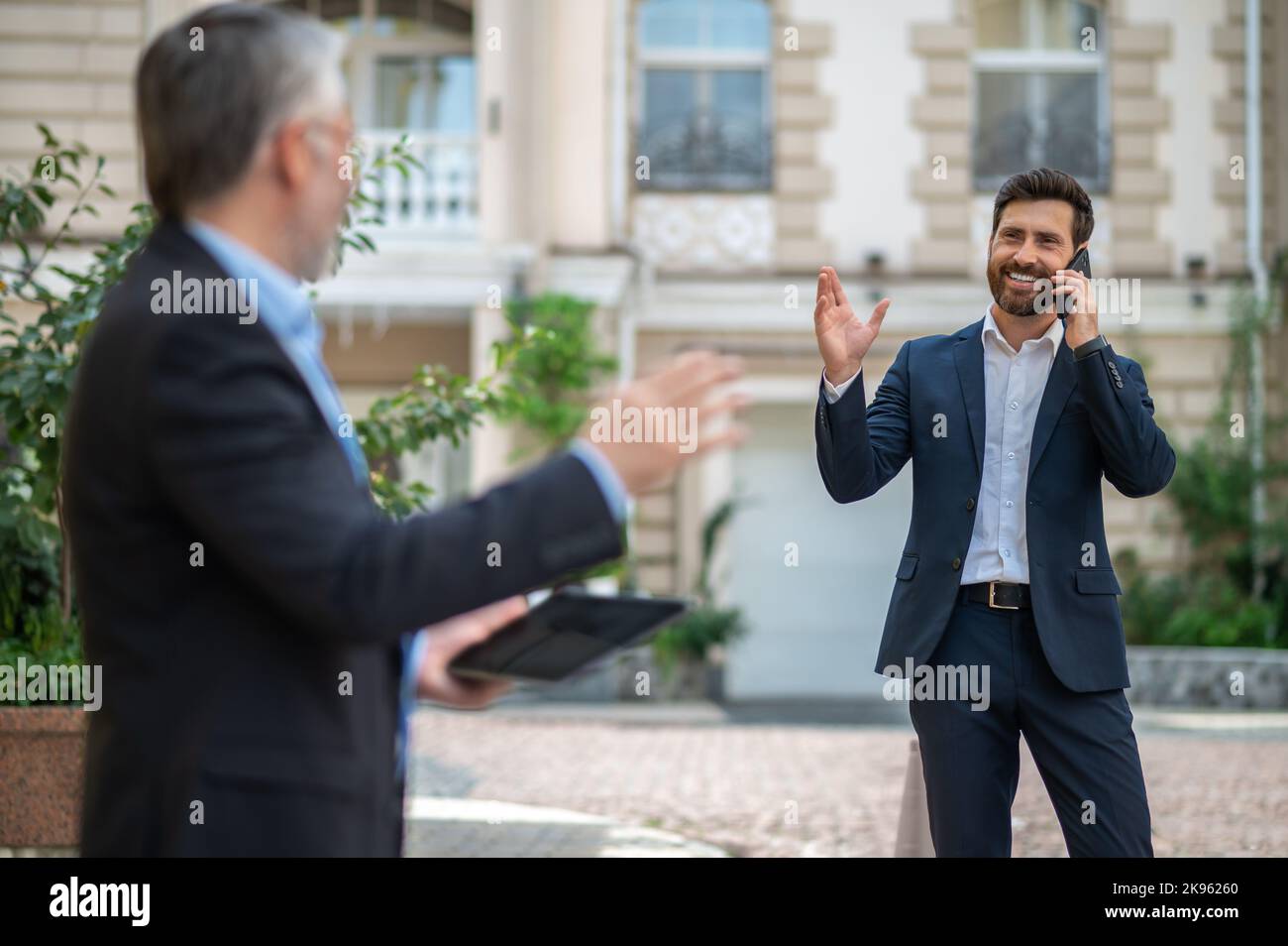 Two businessmen discussing a project Stock Photo - Alamy