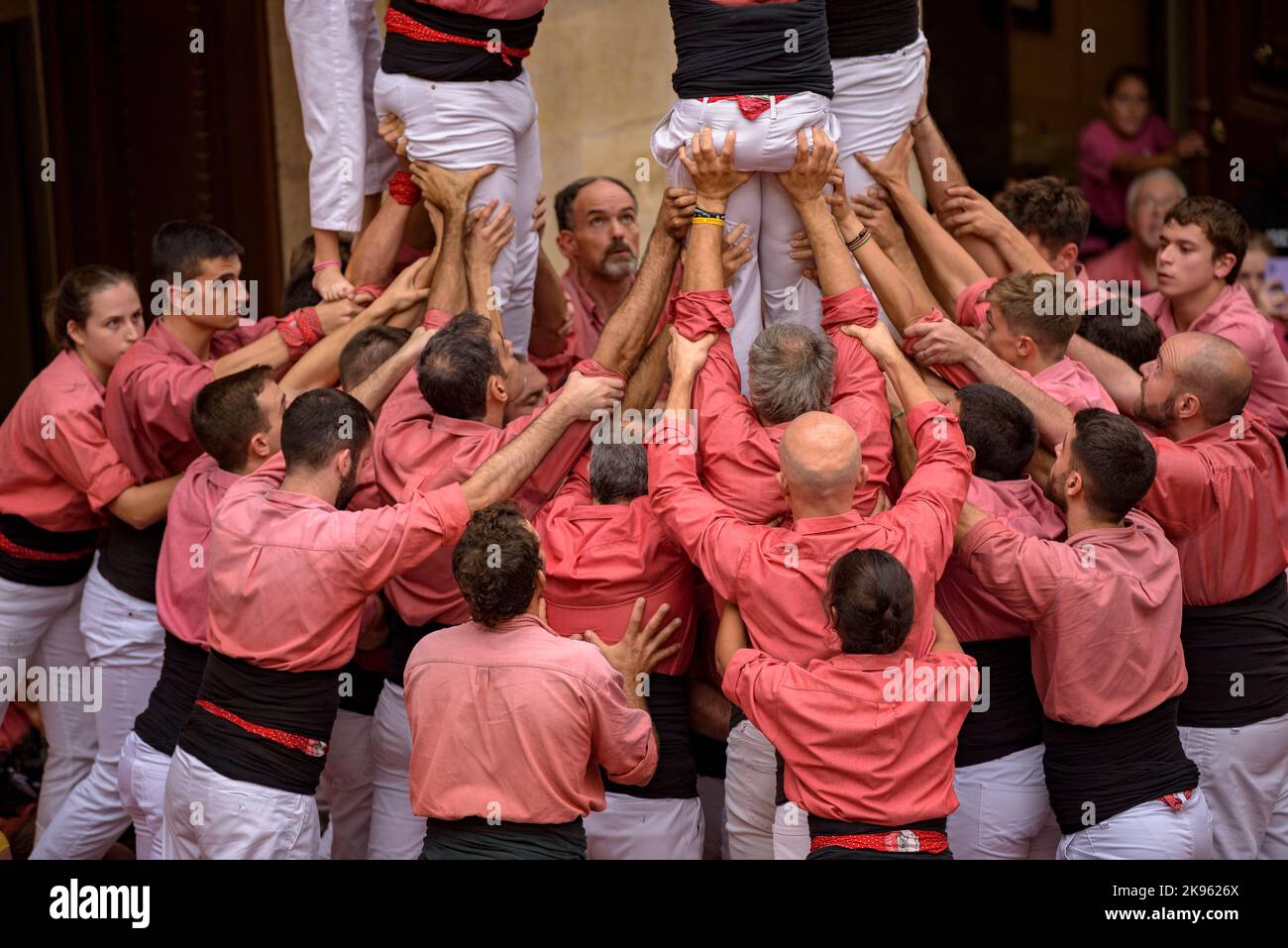 Raising a Castell (human tower) "3 of 9" of the Colla Vella dels ...