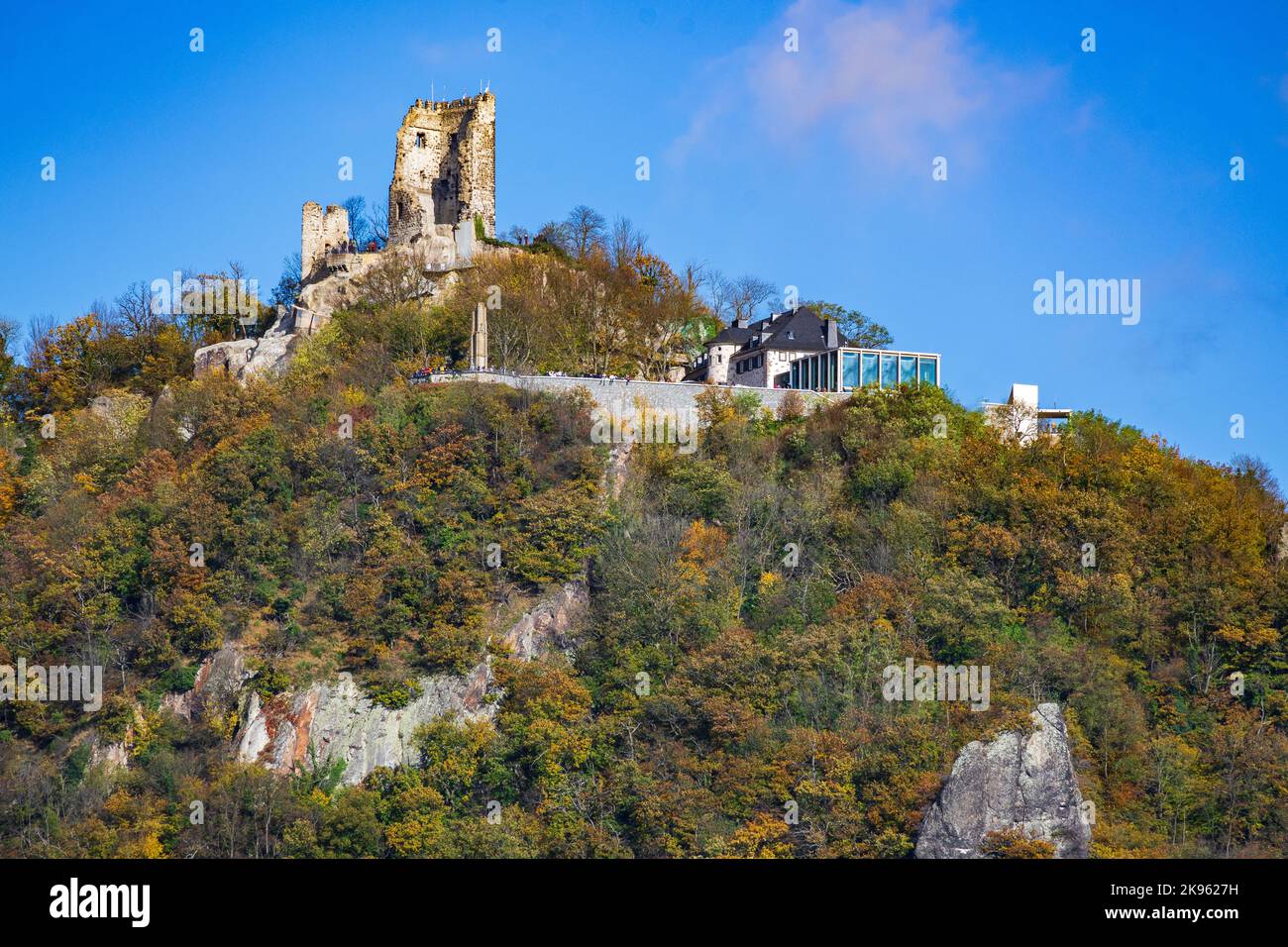 The ruins of an ancient castle on the Drachenfels hill under a blue sky ...
