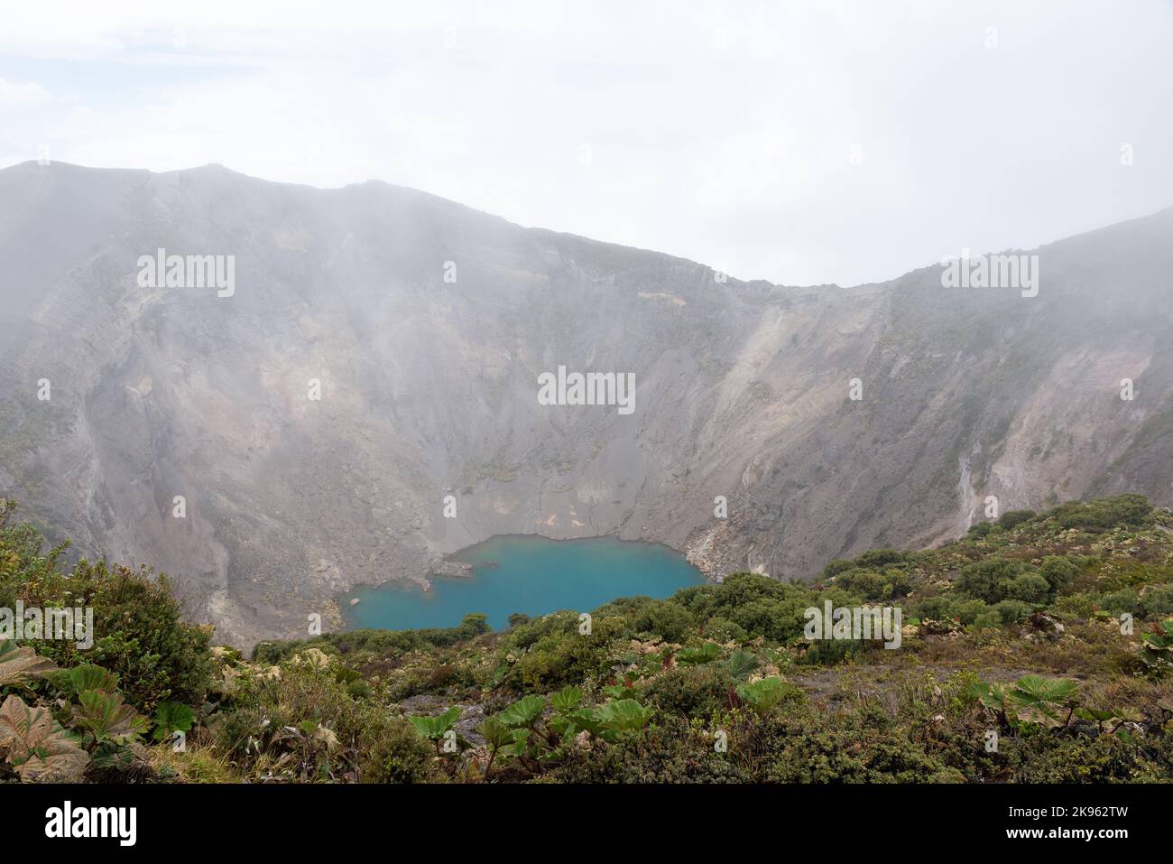 A scenic view of Irazu Volcano and National Park covered with light fog ...