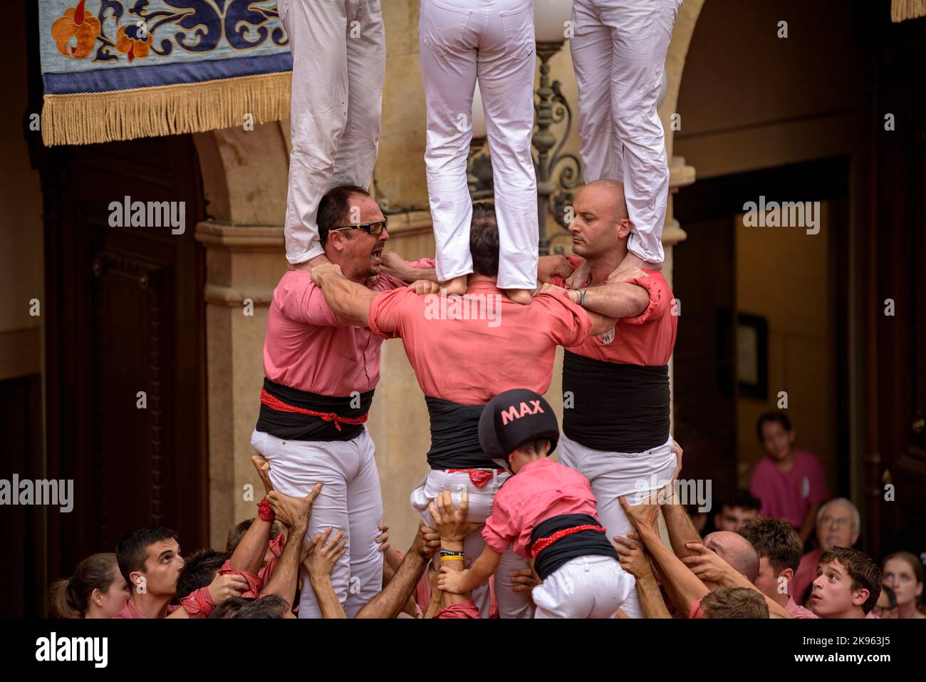Raising a Castell (human tower) "3 of 9" of the Colla Vella dels ...