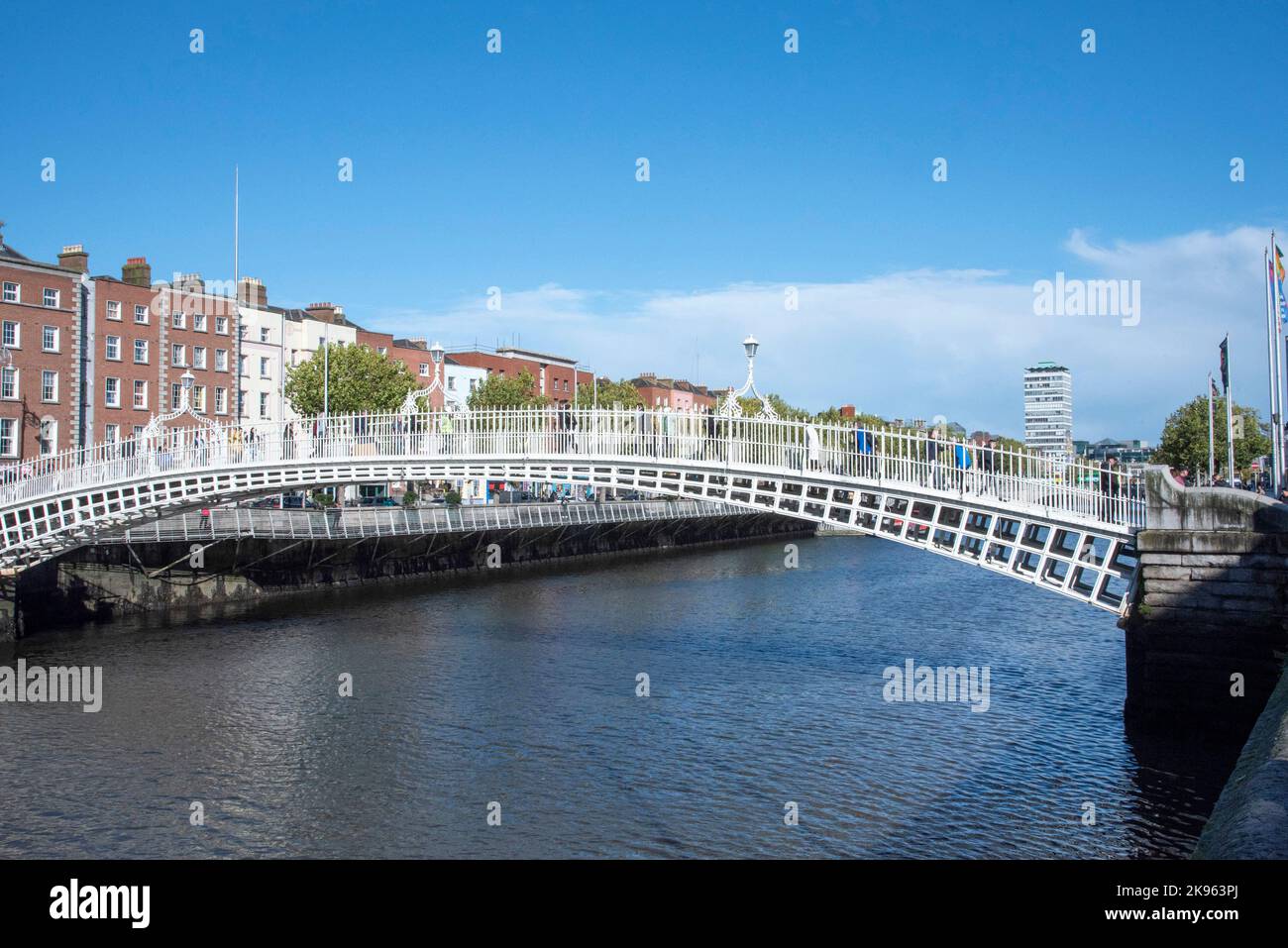 Halfpenny Bridge in an eastbound view of the River Liffey in Dublin ...