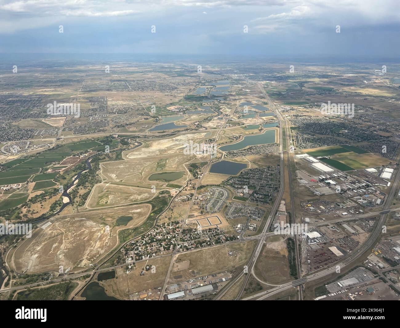 An aerial view of from plane to landscape with buildings Stock Photo ...