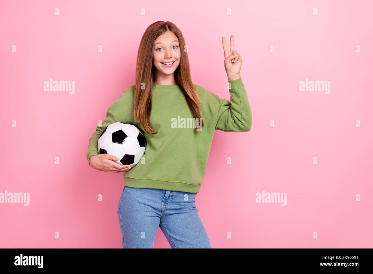Photo of sweet cheerful schoolgirl wear green sweatshirt playing ...