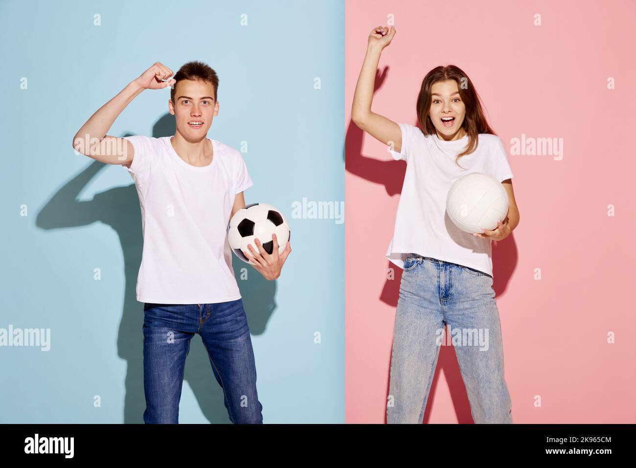 Portrait of young man and woman, sport fans posing with football ball ...
