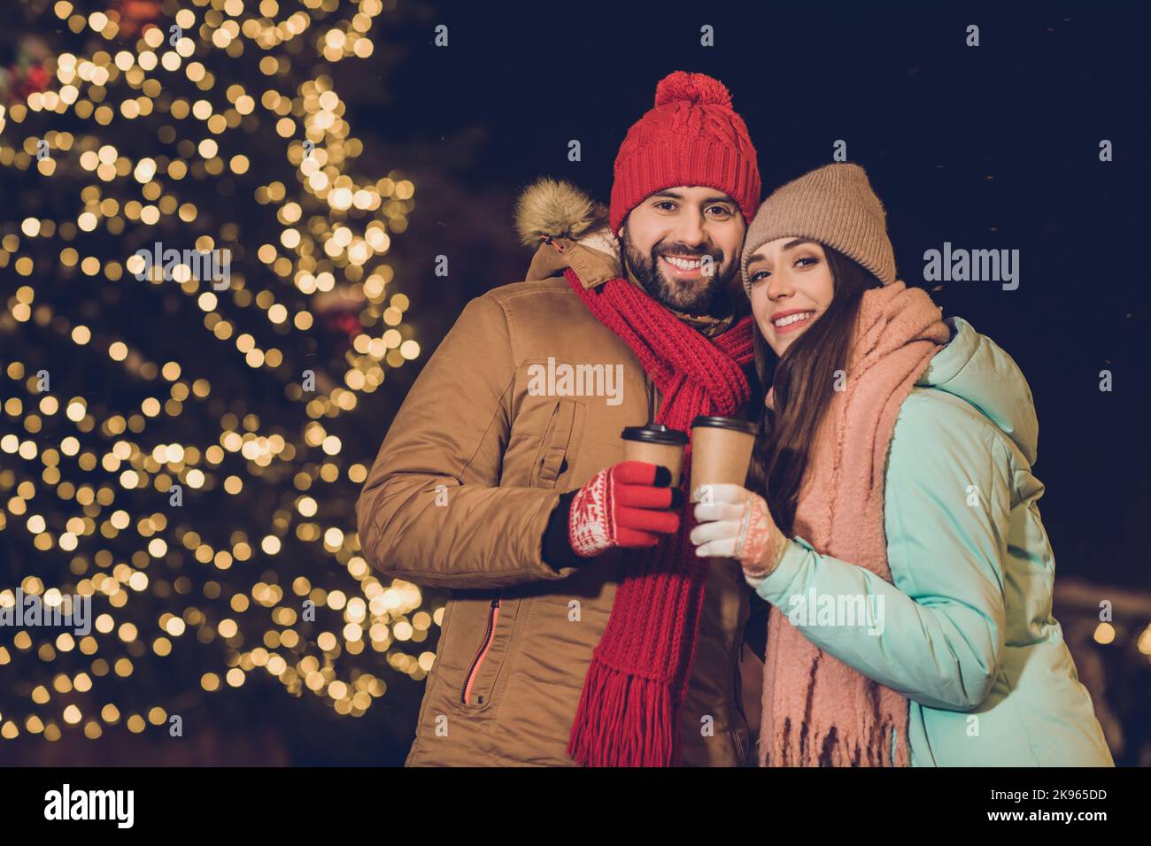 Photo of pretty cite wife husband embracing drinking hot beverages tea ...