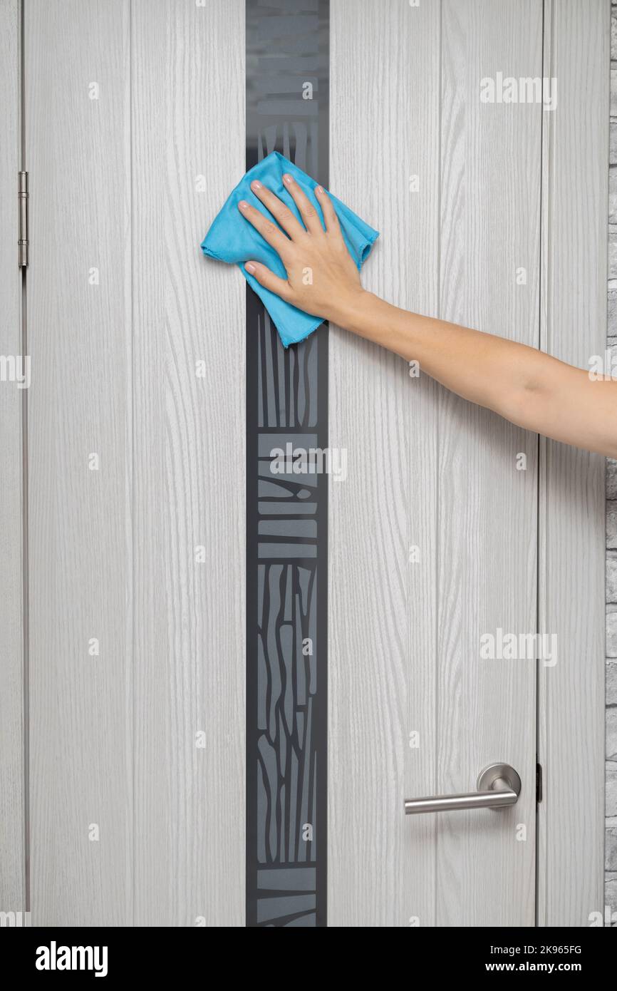 Woman wiping door hi-res stock photography and images - Alamy