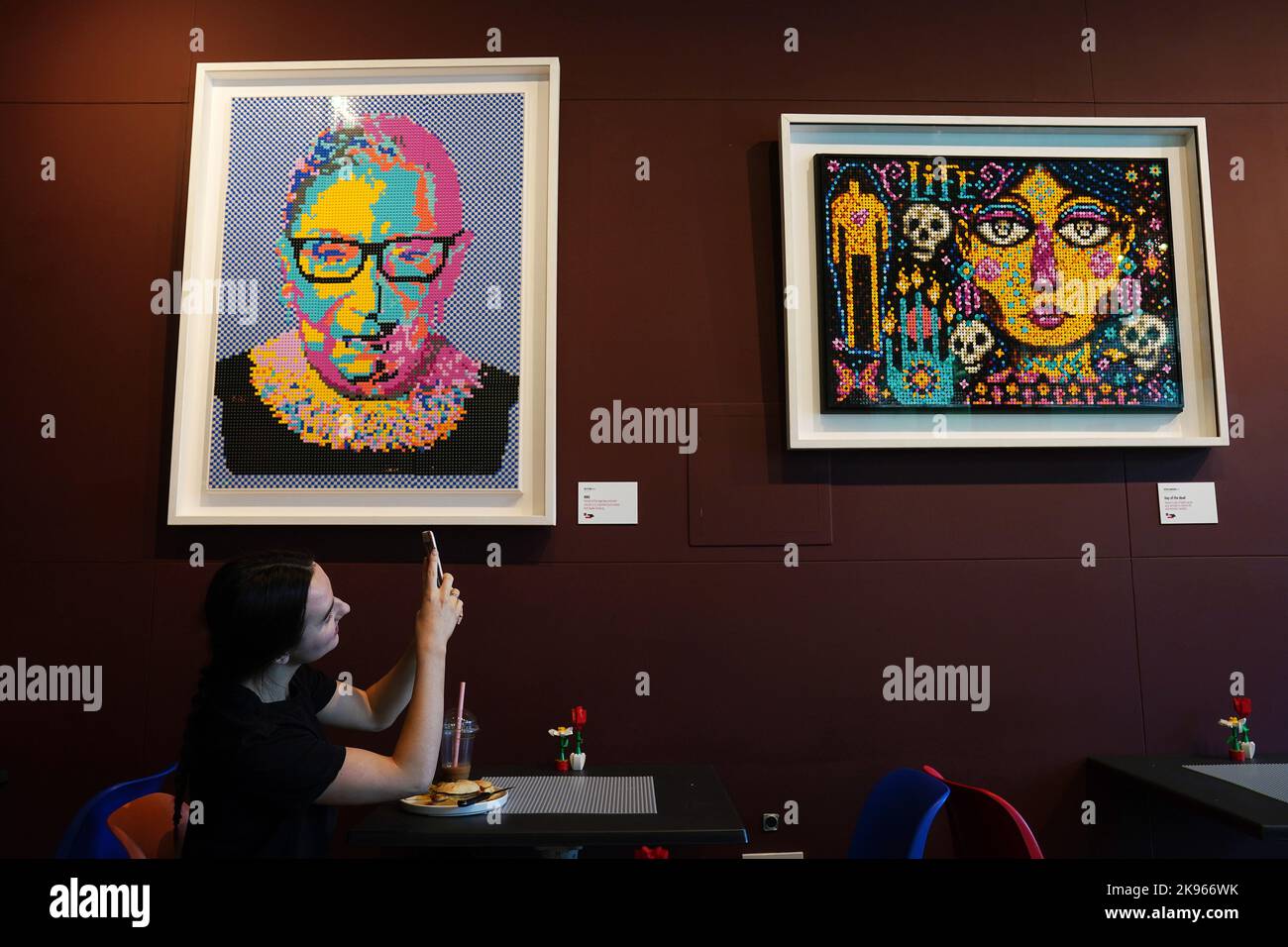 Lily Higgins admires 'Ruth Bader Ginsburg' by Jill & Gill (left) and ...