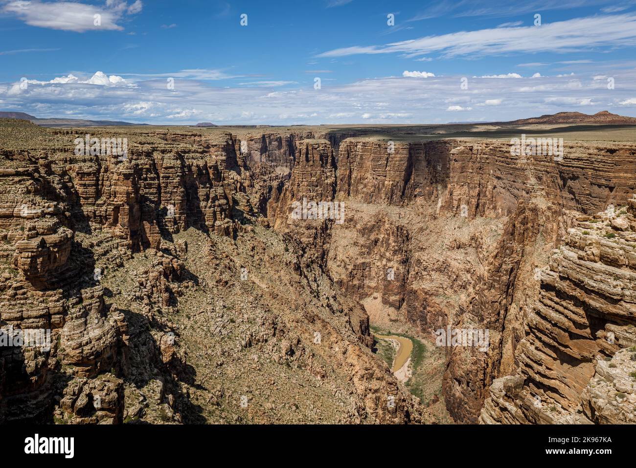 Final ends of the Grand Canyon with high craggy brown rocks near the ...
