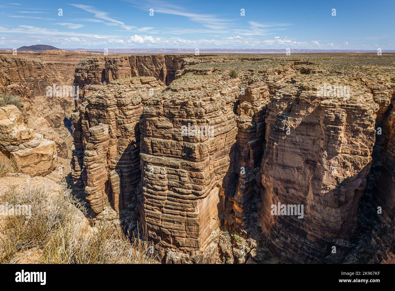 Final ends of the Grand Canyon with high craggy brown rocks near the ...