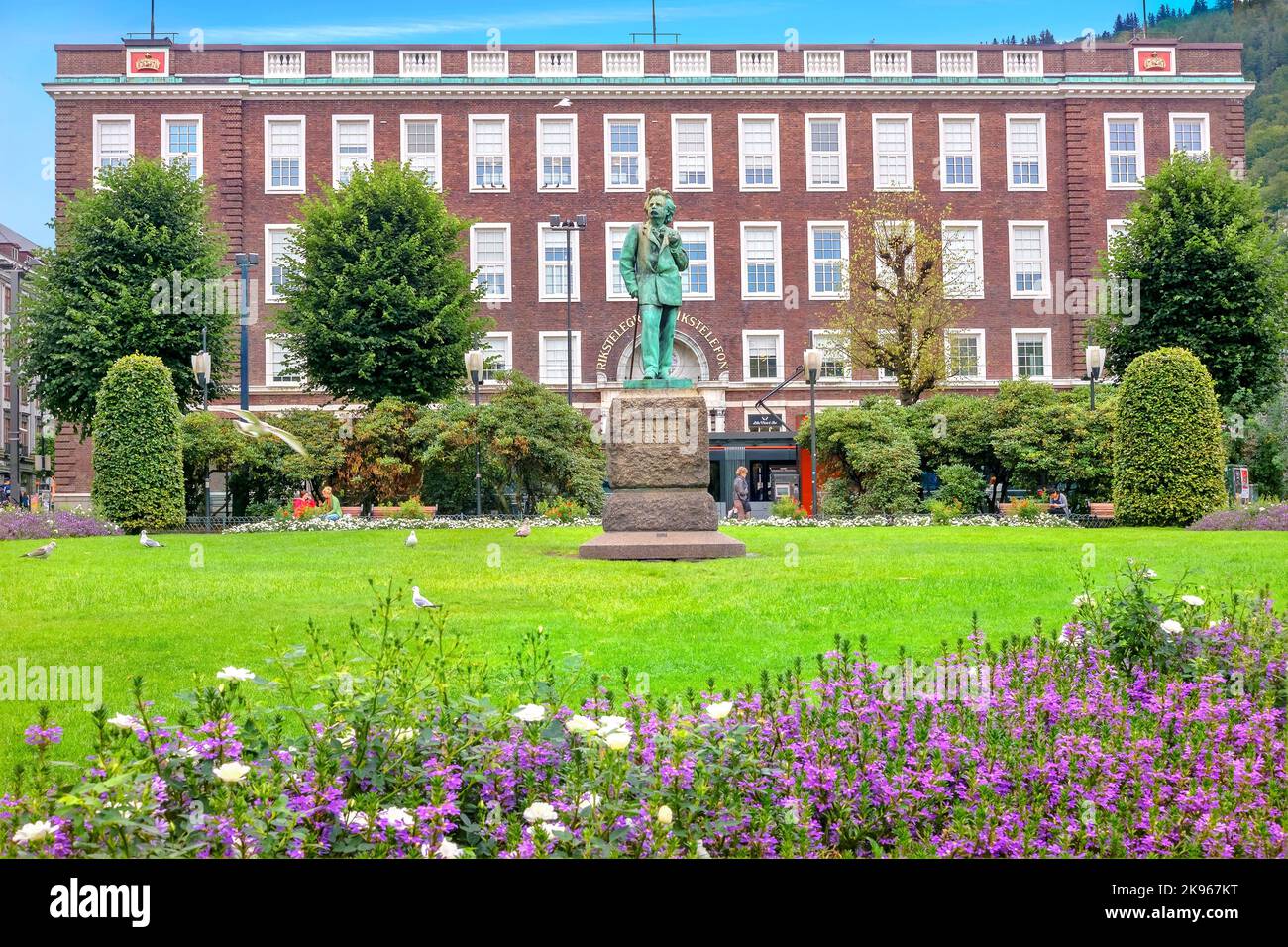 Bronze statue of famous composer Edward Grieg against Rikstelegraf and ...