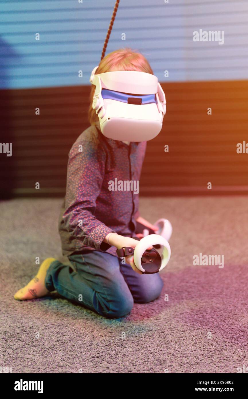 vr game and virtual reality. kid boy gamer six years old fun playing on ...