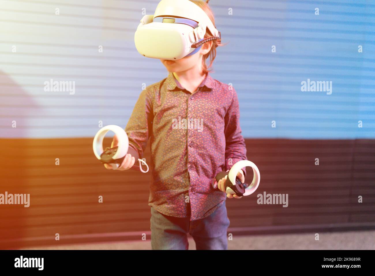 vr game and virtual reality. kid boy gamer six years old fun playing on ...