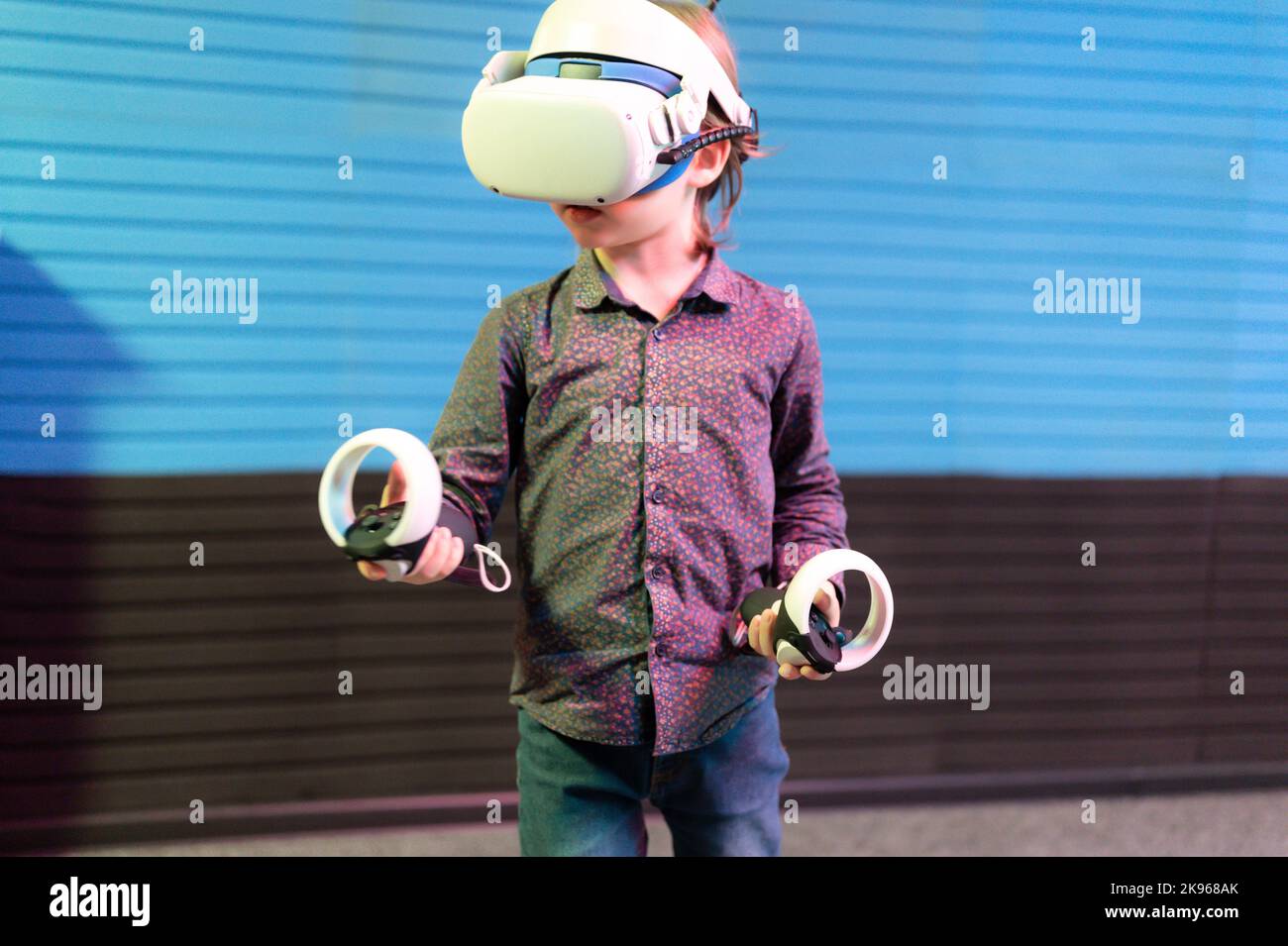 vr game and virtual reality. kid boy gamer six years old fun playing on ...