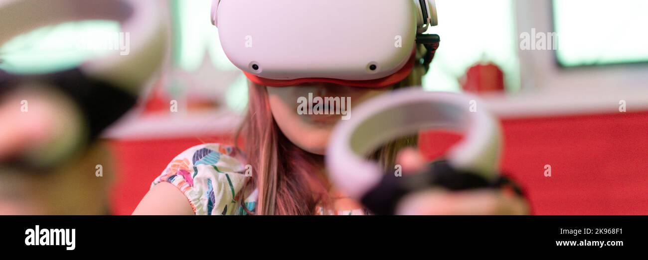 vr game and virtual reality. kid girl gamer eight years old fun playing ...