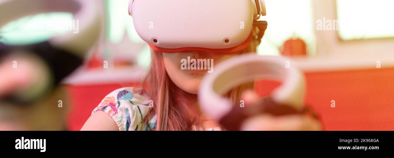 vr game and virtual reality. kid girl gamer eight years old fun playing ...