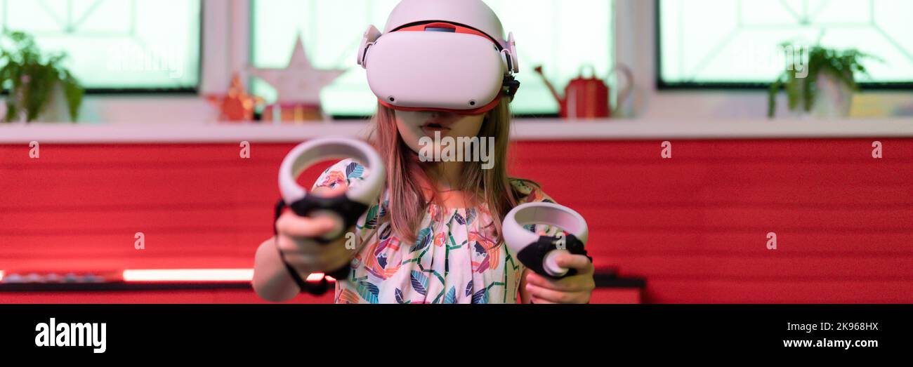 vr game and virtual reality. kid girl gamer eight years old fun playing ...