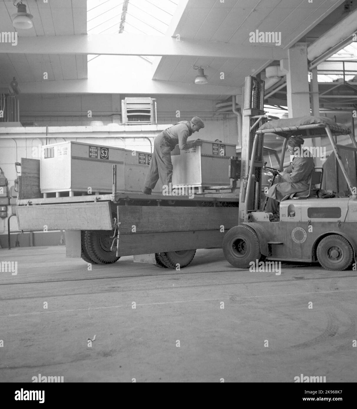 Small containers are loaded with truck, Liljeholmens cable plant Stock ...