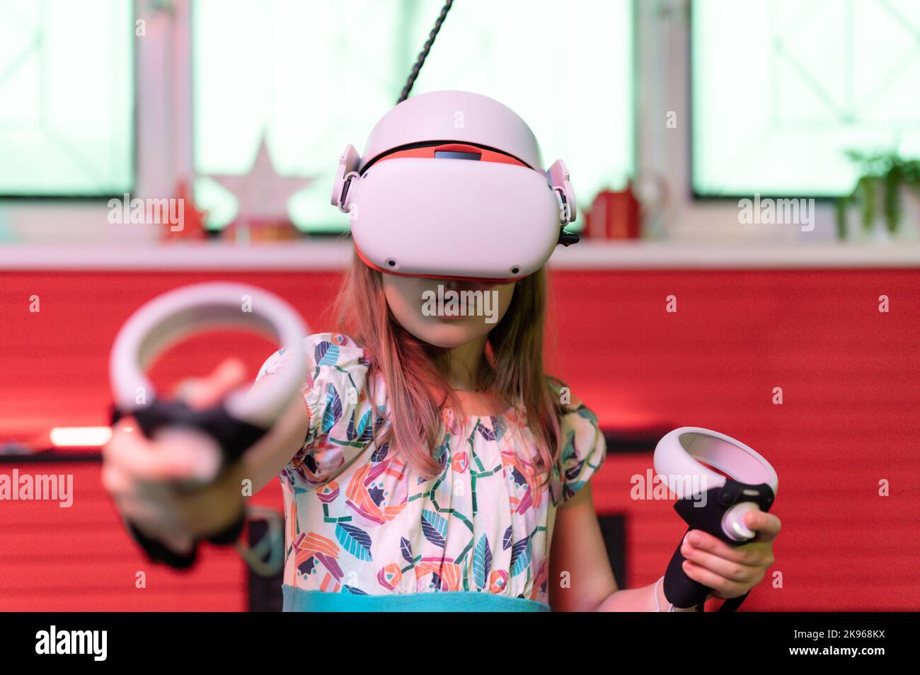 vr game and virtual reality. kid girl gamer eight years old fun playing ...