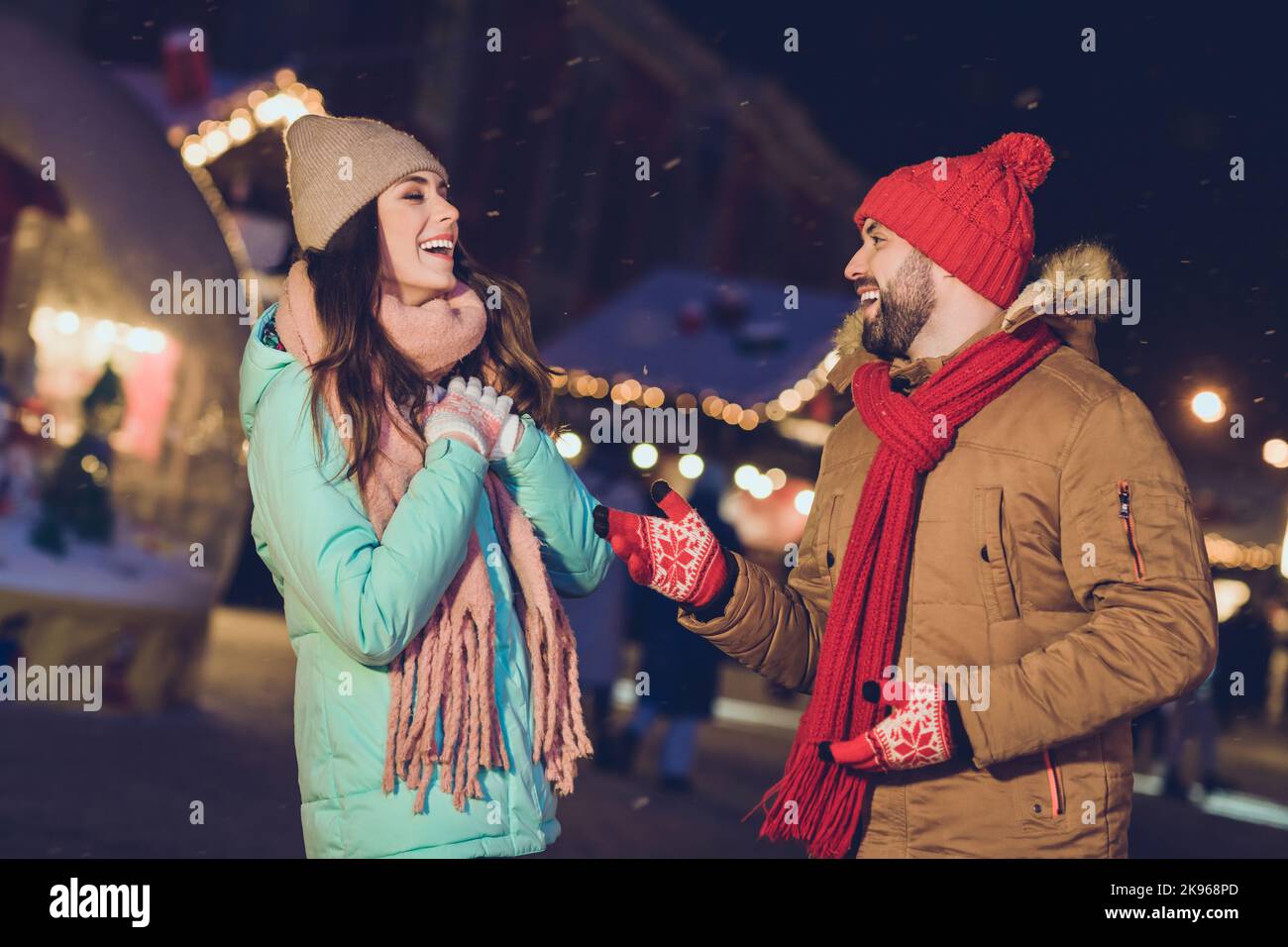 Profile photo of enjoy couple laugh wear cap jacket scarf gloves ...