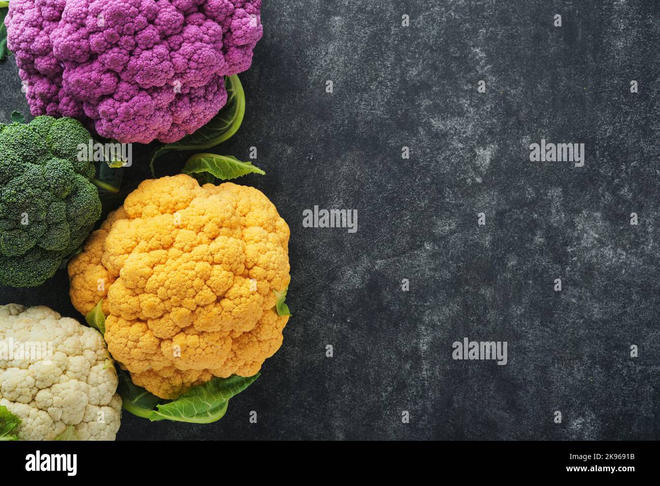 Colorfu cauliflower. Various sort of cauliflower on old dark gray ...