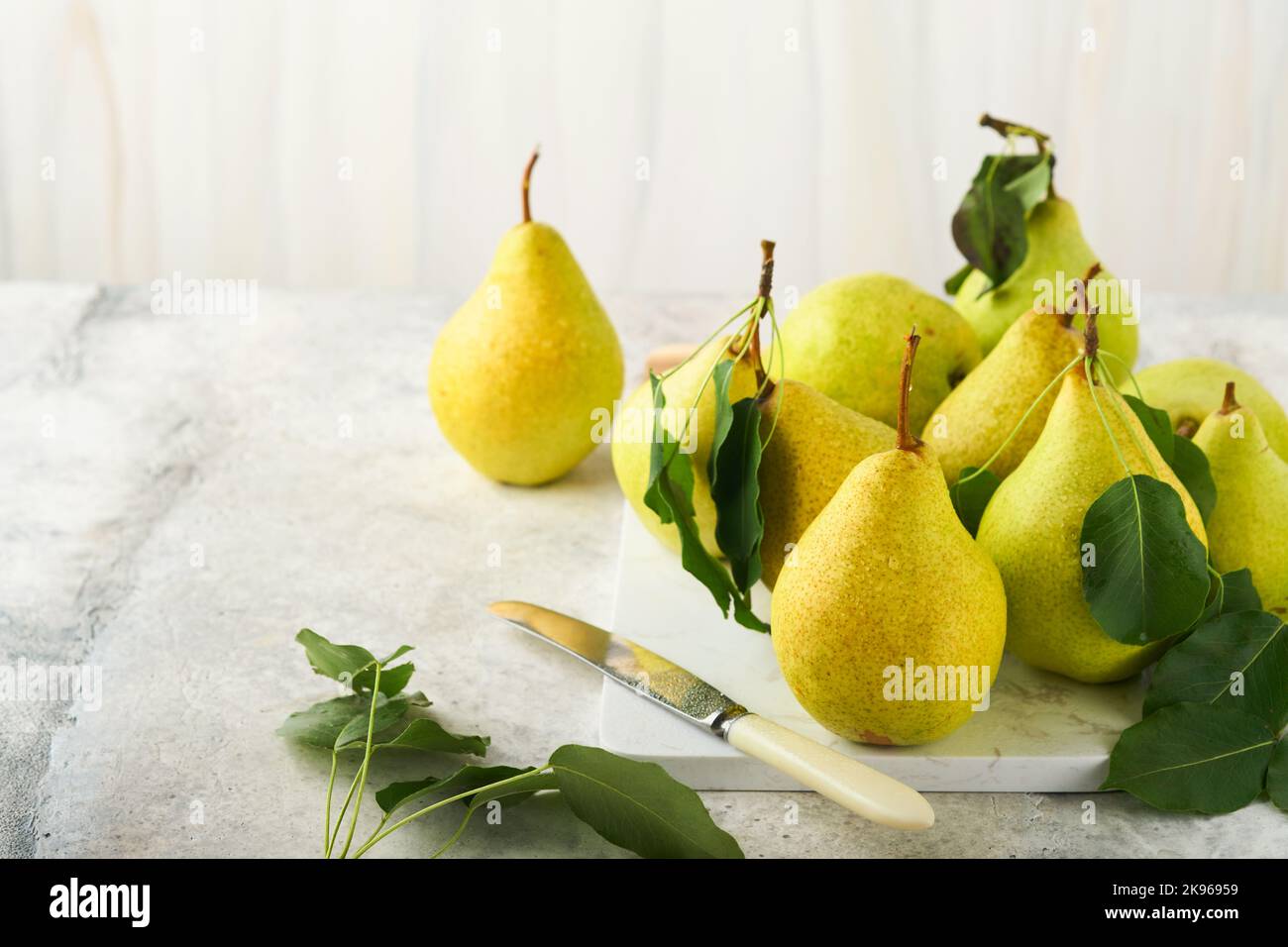 Pears. Fresh sweet organic pears with leaves on stand or plate on old ...